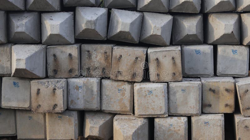 Close-up of a Stack of Prestressed Concrete Piles on the Ground for ...