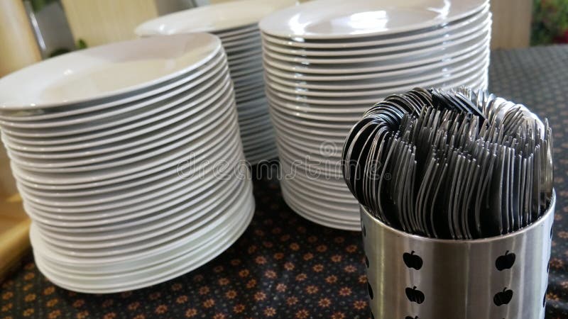 Close Up of Stack of Stainless Steel Dinnerware in a Restaurant. Eating ...