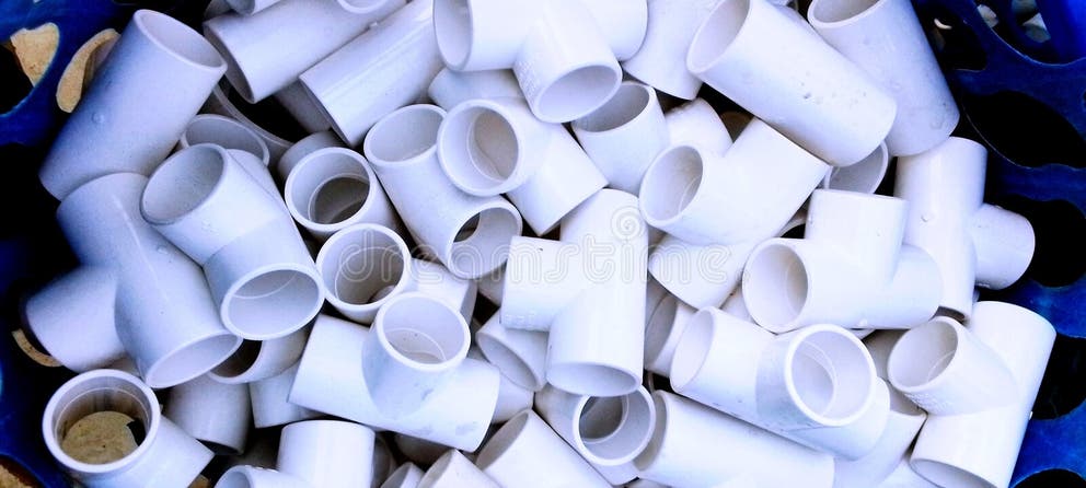 Close Up of Stack of White PVC Pipe in a Warehouse Stock Photo - Image ...