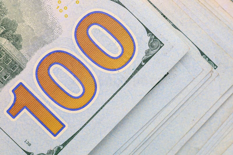 Close-up of Stacked Hundred Dollar Bills with Blue Security Stripe ...