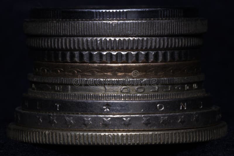 Various Coins Lying Over Different Currency Banknotes Dollars and ...