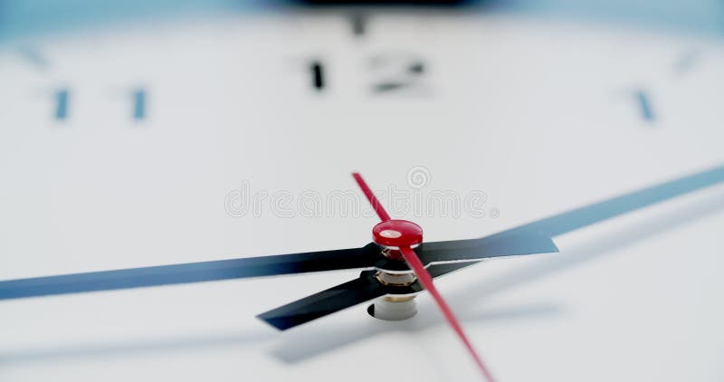 Clock Face with Red Second Hand Passing Over Minute and Hour Hands ...