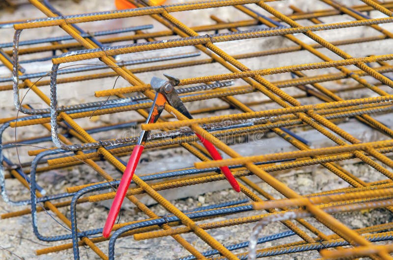Builder`s Hands Fixing Steel Reinforcement Bars at Construction Site ...