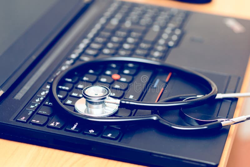 Close Up of a Stethoscope and a Computer Keyboard Laptop Stock Photo ...