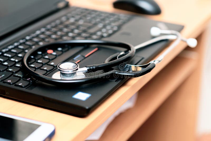 Close Up of a Stethoscope and a Computer Keyboard Laptop Stock Photo ...