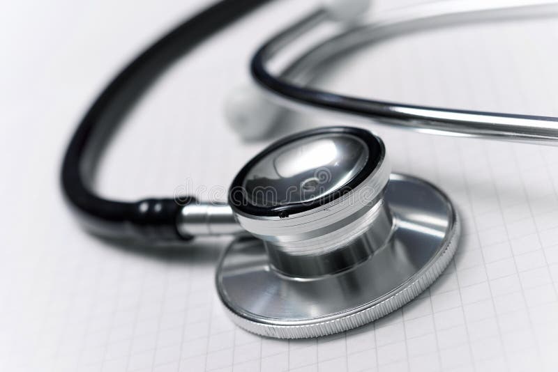 Stethoscope on graph paper stock photo. Image of hospital - 179043448