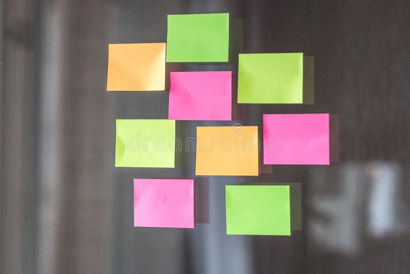 Close-up of Sticky Multicolored Notes on a Glass Wall in the Office ...