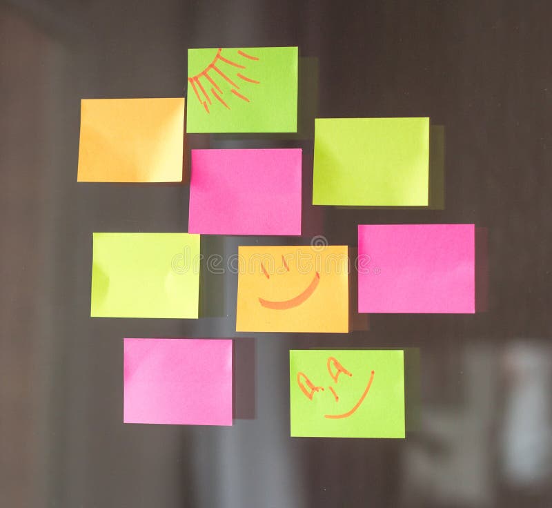Close-up of Sticky Multicolored Notes on a Glass Wall in the Office ...