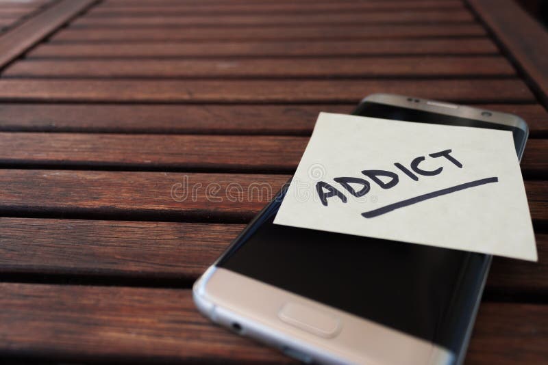 Close Up of Sticky Note on Mobile Phone Telling User they are Addicted ...