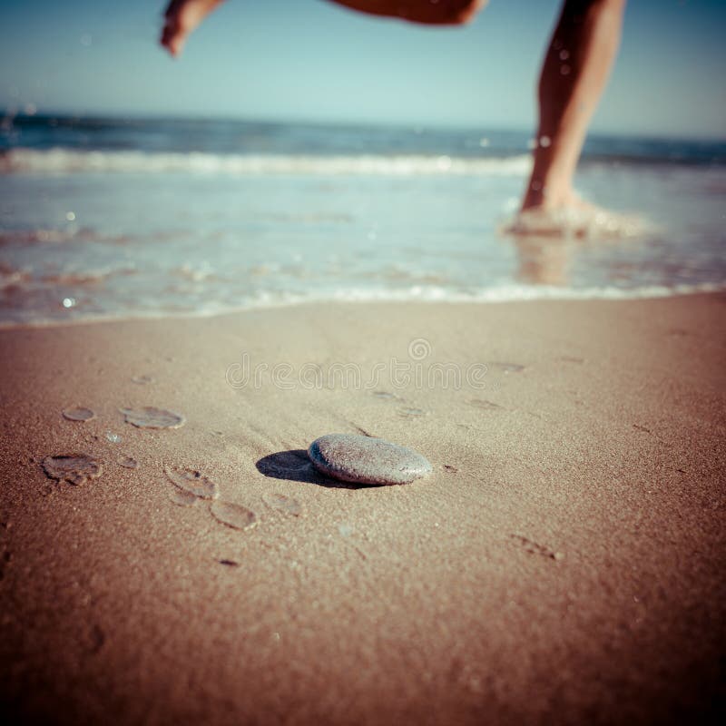 Close Up of Stone in the Beach Legs Running Stock Image - Image of ...