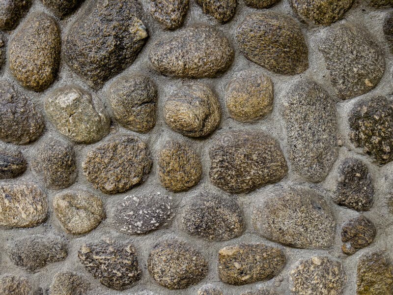 Close-up Stone Wall Texture Background with Gray Pebbles and Rocks on ...