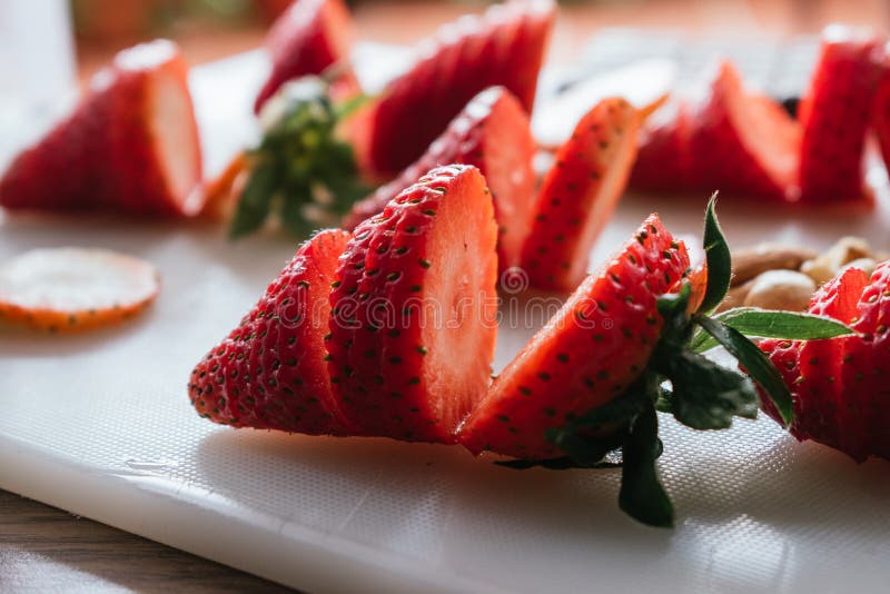 Strawberries Cut into Slices with Chocolate and Nuts Stock Photo ...