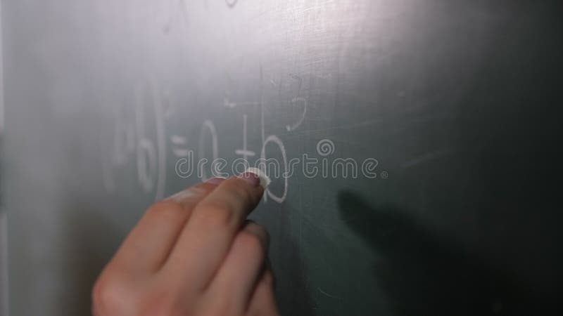 Close-up of a Student Girl Writing Math Formulas with Chalk on a ...