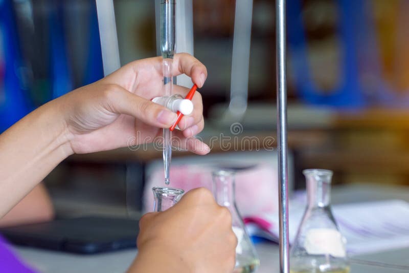 Close Up Student Performing Acid Base Titration Experiment Stock Photos ...