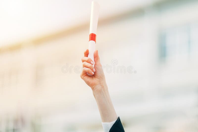 Close-up of a Student`s Hand Holding a Graduation Diploma Stock Photo ...