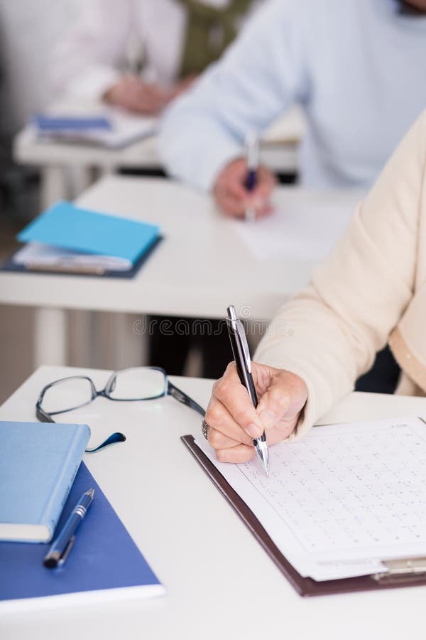 Close-up of Student Writing Exam Stock Photo - Image of paperwork ...