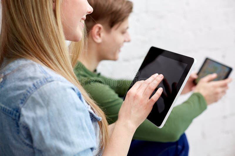 Two Students Watching Tablet while Professor Giving Lecture Stock Photo ...