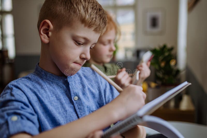 Close Up of Students Writing Notes in To Their Notepads. Stock Photo ...