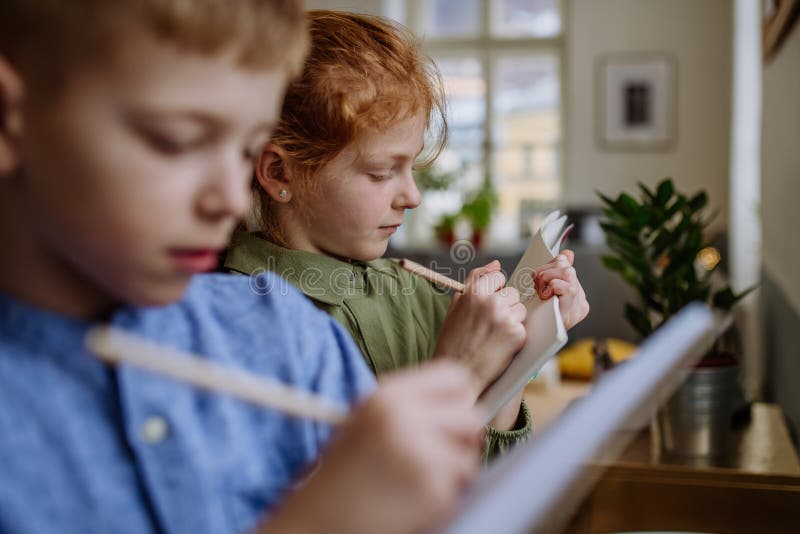 Close Up of Students Writing Notes in To Their Notepads. Stock Image ...