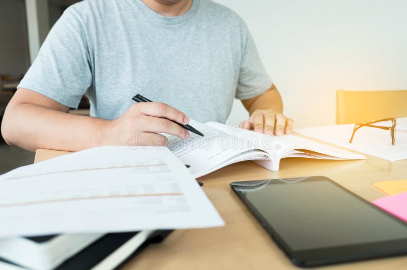 Close Up Of Studying Student Hands Writing In Book During Lecture ...