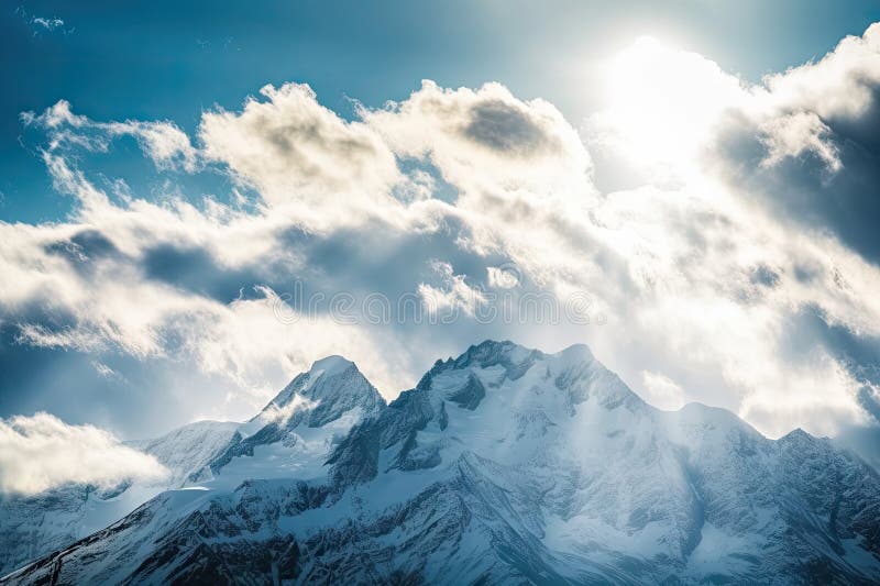 Close-up of Stunning Mountain Range with Clouds, Sun, and Blue Skies ...