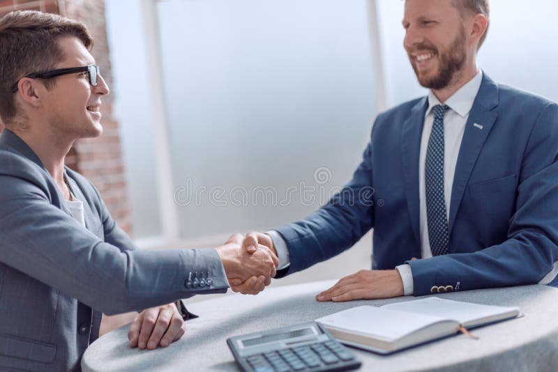 Close Up. Successful Financial Partners Shaking Hands Stock Photo ...