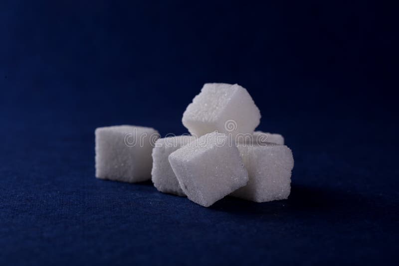 Close-up of Sugar Cubes on Blue Background Stock Image - Image of ...