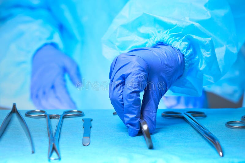 Close-up of of Surgeons Hands at Work in Operating Theater Toned in ...