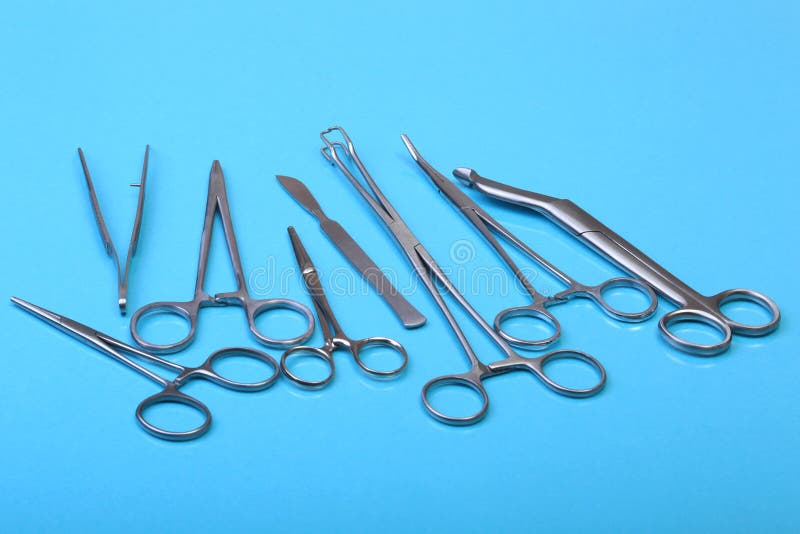 Close Up Surgical Instruments and Tools on Blue Mirror Background ...
