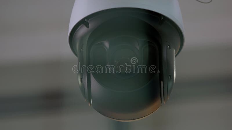 Surveillance Video Camera on Wall Looking at Parking Lot with Vehicles ...