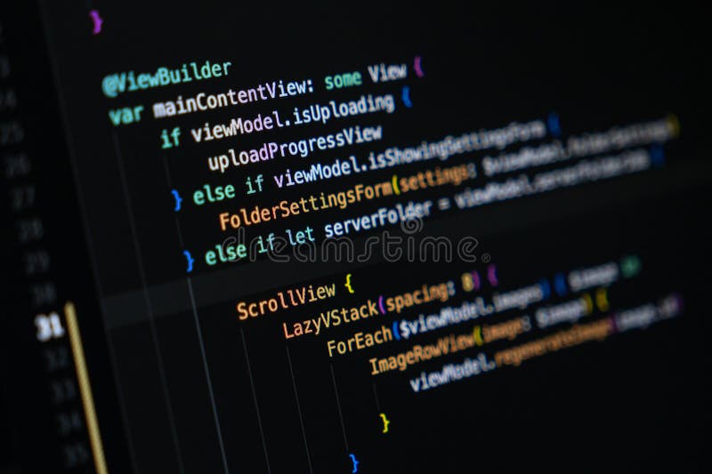 Close-up of Swift Programming Code on a Computer Screen Showing Mobile App Interface Structure ...