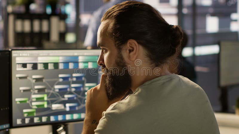 Close Up of System Administrator Transforming Data into Predictive ...