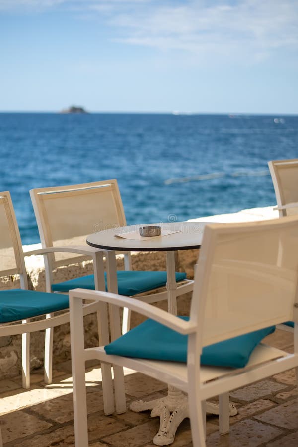 Close Up of Table Setting at Open-air Cafe on Beach Stock Photo - Image ...