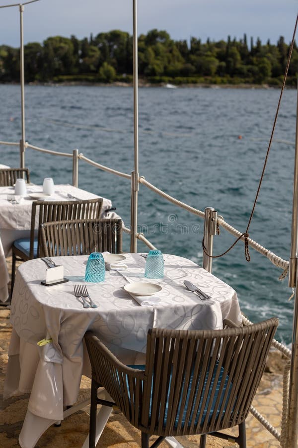 Close Up of Table Setting at Open-air Restaurant on Beach Stock Photo ...