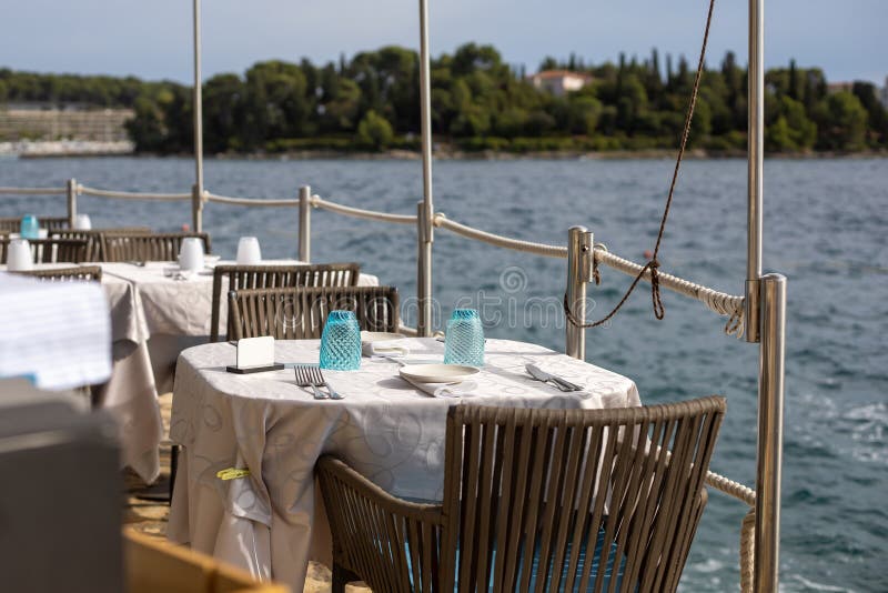 Close Up of Table Setting at Open-air Restaurant on Beach Stock Image ...