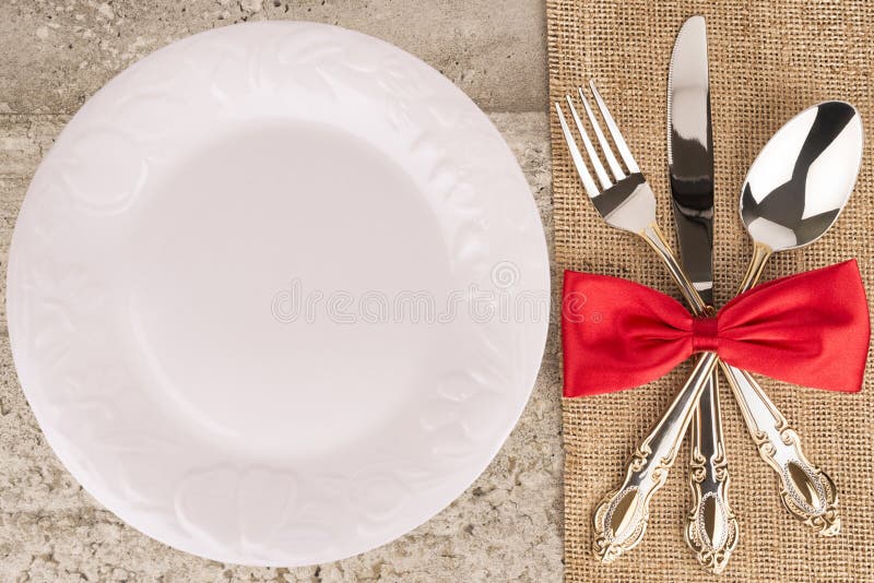 Close Up on Table Settings with a Decorative Red Bow. Stock Image ...