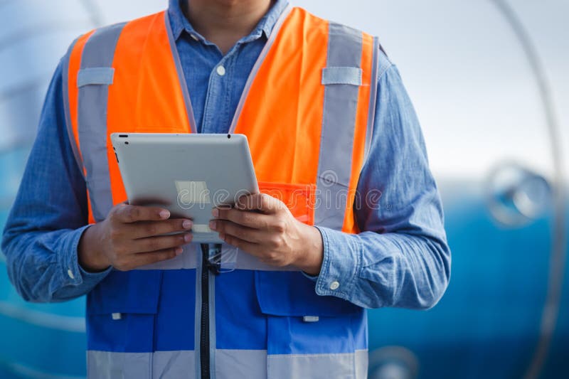 Close Up Tablet with Man Engineer Working at Rooftop Building ...