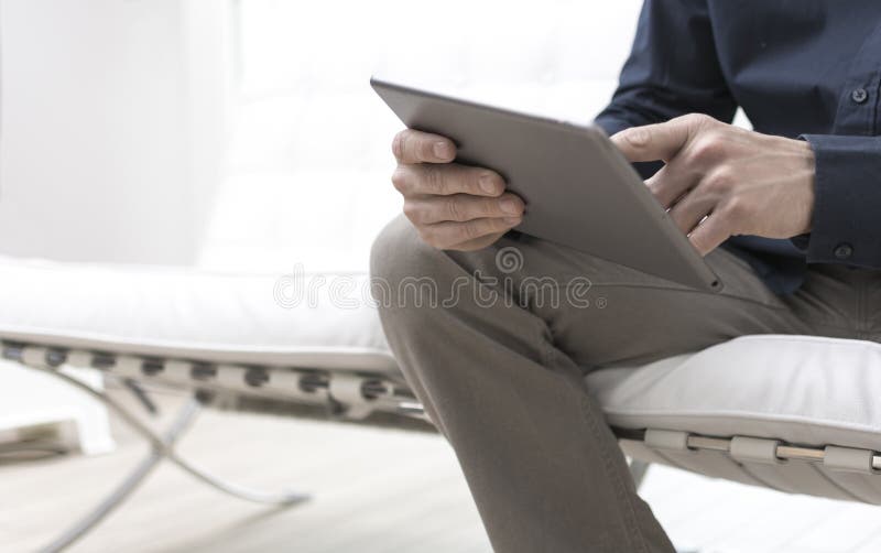 Tablet user looks excited stock image. Image of chair - 169557463