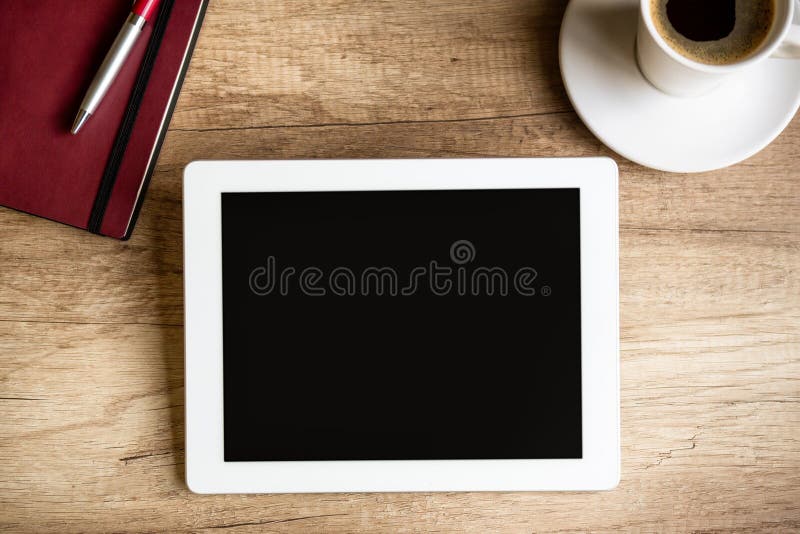 Tablet on wooden table stock photo. Image of gadgets - 41583596