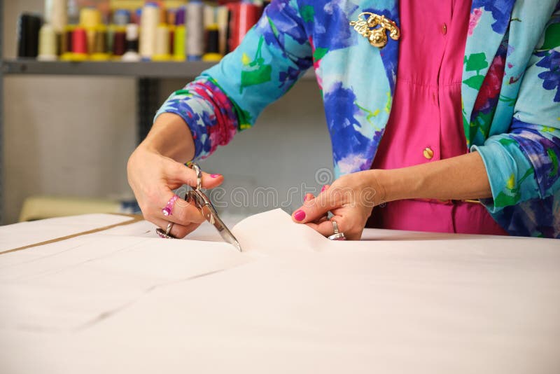 Close Up of Tailor Wearing Colorfull Clothes Cutting Sewing Patterns ...