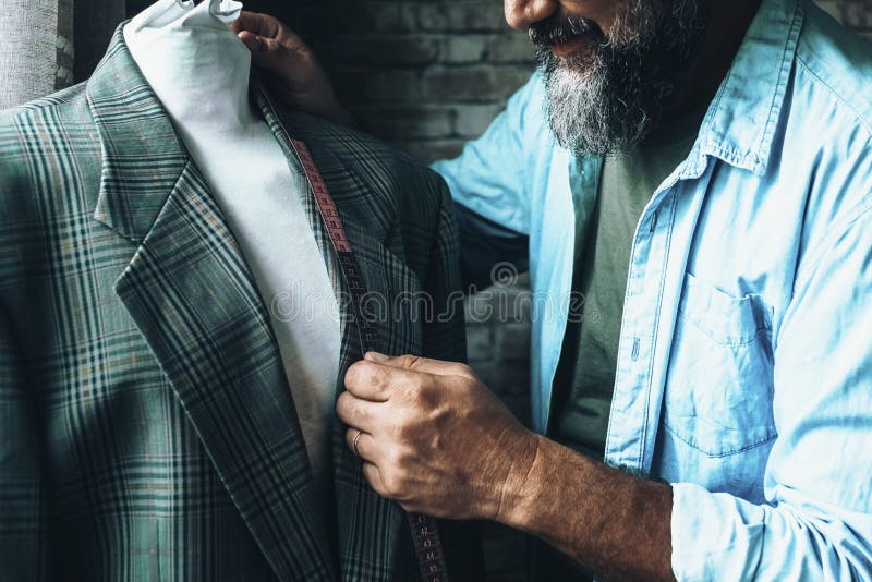 Close Up of Tailor at Work in the Workshop Taking Measures of an ...