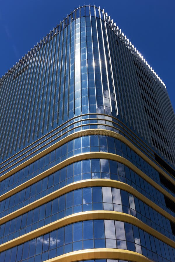 A Close-up of a Tall Skyscraper Corner Against the Sky. Glass ...