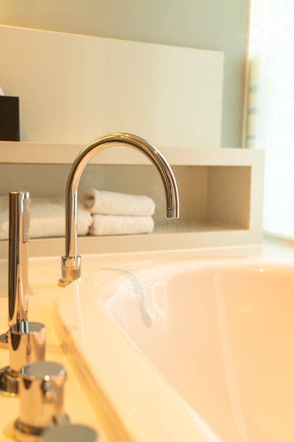 Close up tap on bath tub stock image. Image of light - 263143557