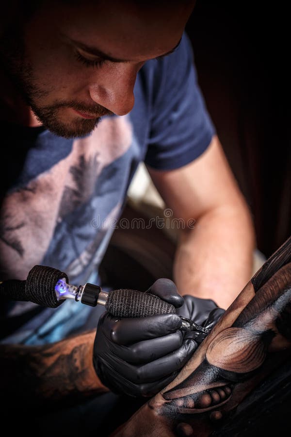 Close up tattoo artist stock photo. Image of gloves - 103299418