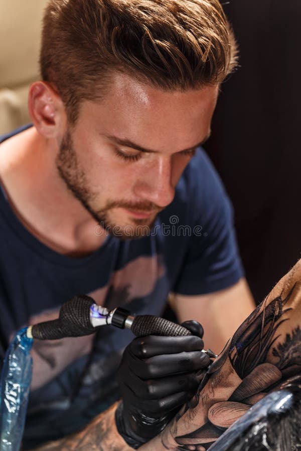 Professional tattoo artist stock photo. Image of equipment - 103233004