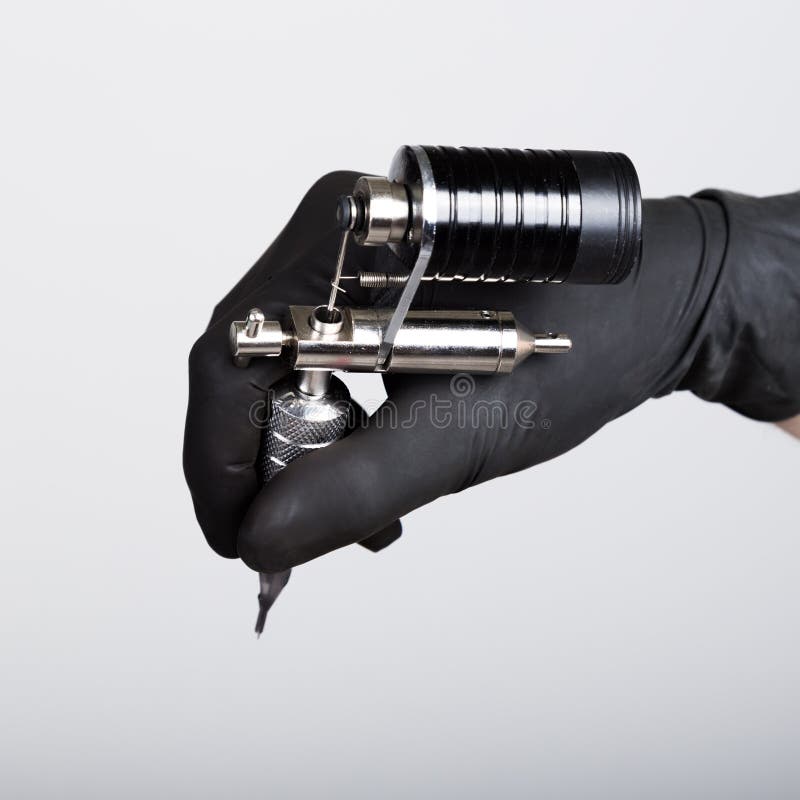 Close-up of Tattooist Hands in Black Gloves with Tattoo Machine Stock ...