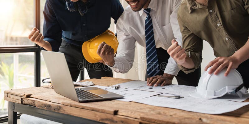 Close Up of a Team of Engineers Enjoying the Success of Their Joint ...