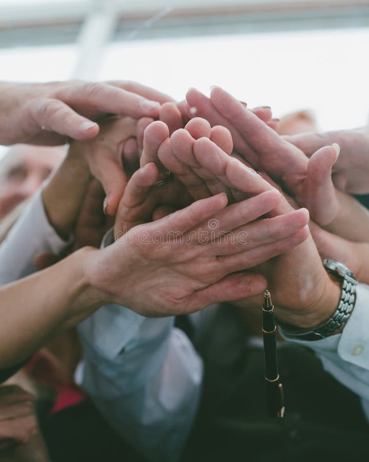 Close Up. a Team of Experienced Employees Showing Their Unity Stock ...