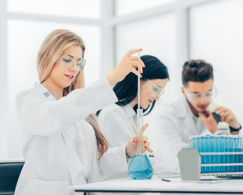 Close Up.a Team of Scientists Conduct Fluid Research Stock Image ... Close Up.a Team of Scientists Conduct Fluid Research Stock Image ...