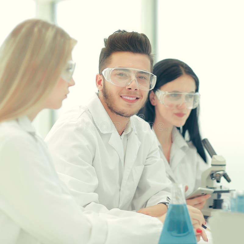 Close Up.a Team of Scientists Use a Computer To Check the Data Stock ...